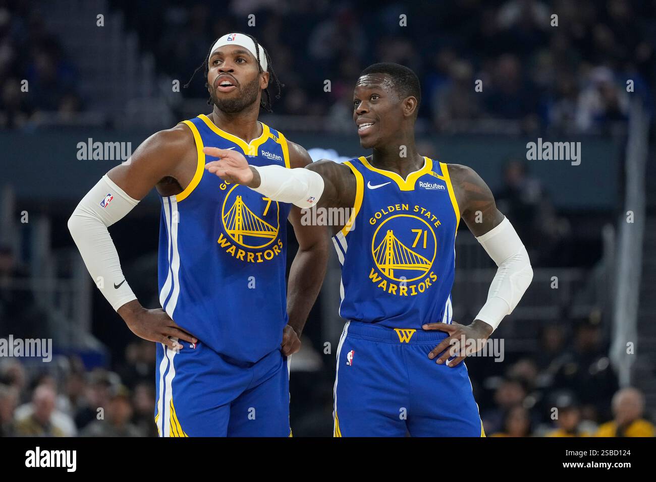 Golden State Warriors guard Buddy Hield, left, and guard Dennis ...