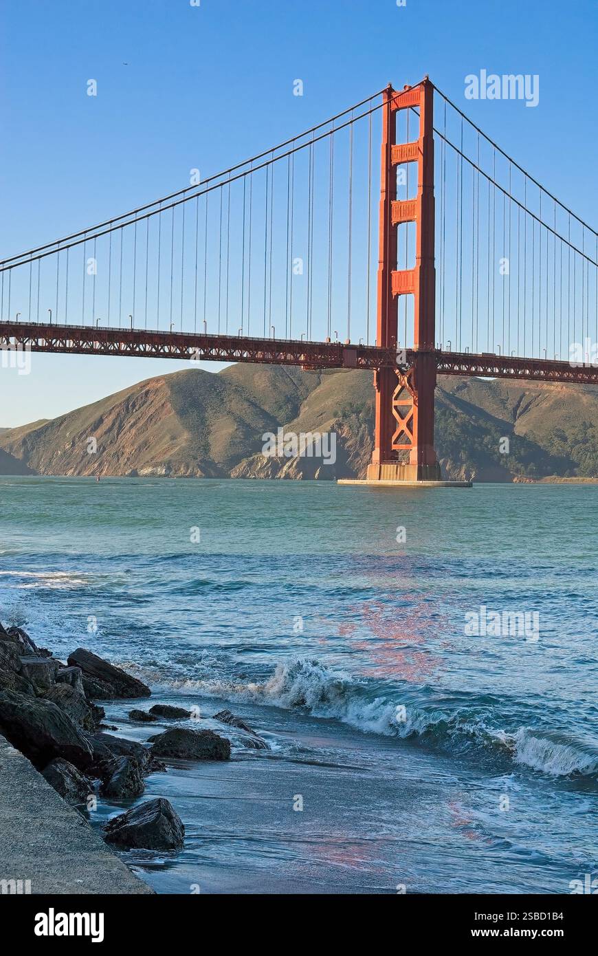 Waves crash against rip rock abutment at Fort Point under the Golden ...