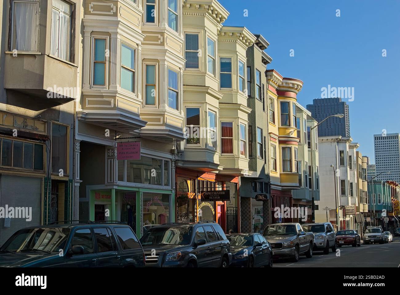 Street lined with colorful bay window adorned row houses in San ...