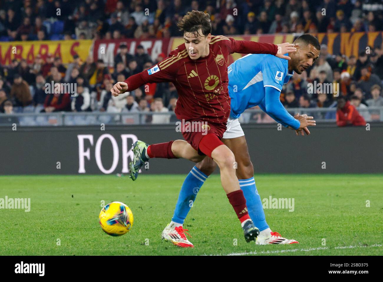 Rome, Italy. 2nd Feb, 2025. Niccolo Pisilli, left, of Roma, is ...
