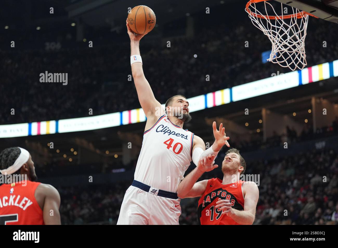 Toronto, Canada. 02nd Feb, 2025. LA Clippers centre Ivica Zubac (40) dunks over Toronto Raptors ...