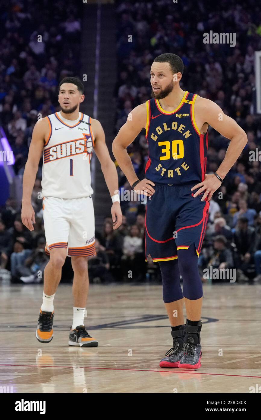 Phoenix Suns guard Devin Booker (1) and Golden State Warriors guard ...