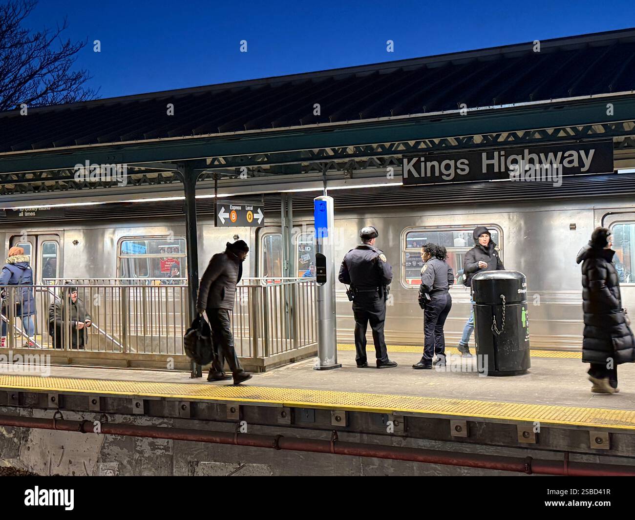 Police presence on the elevated subway platform at Kings Highway along ...