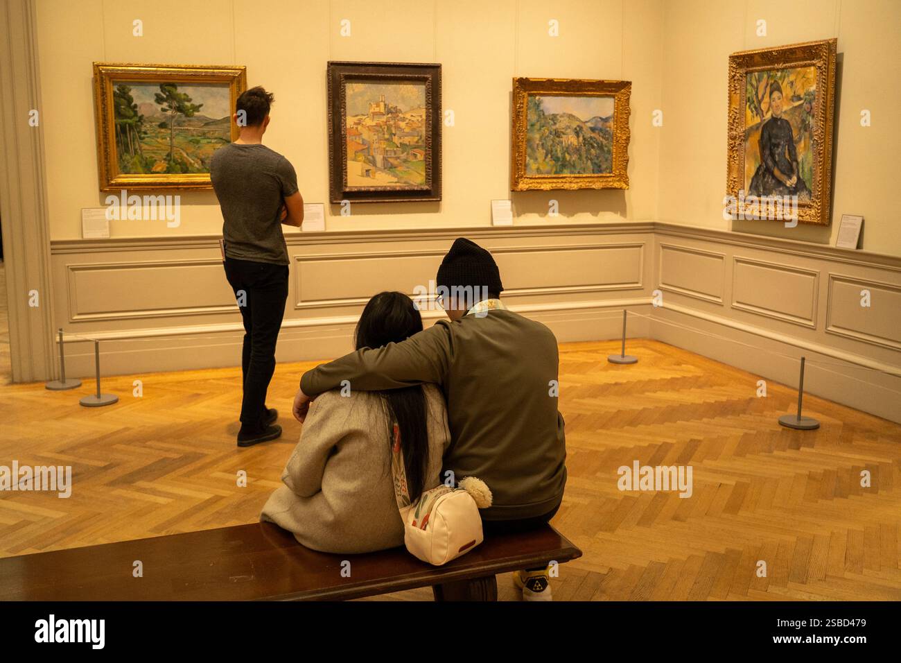 Young couple take a break in the 19th century European Galleries at the Metropolitan Museum of ...