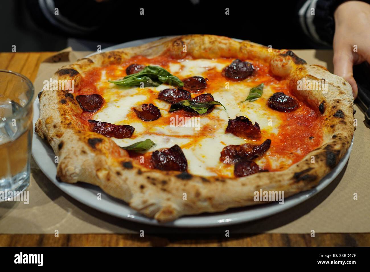 Delicious Italian pepperoni pizza at Italian pizzeria Stock Photo - Alamy
