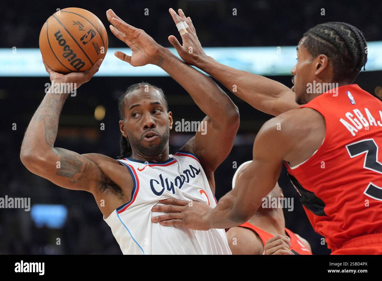 Los ANgeles Clippers forward Kawhi Leonard, left, looks downcourt to ...