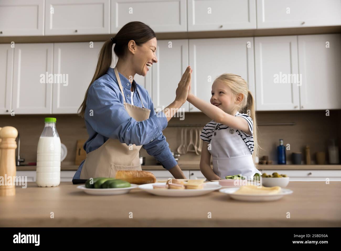 Little helper mother daughter hi-res stock photography and images - Alamy