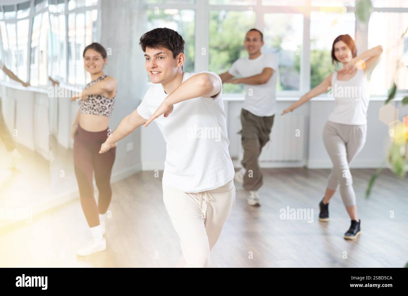 Guy enjoys active dancing, learns new movements, moves synchronously ...