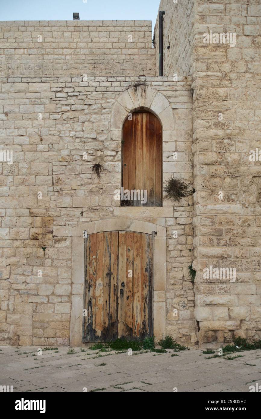 a door without stairs above another door in the walls of Norman ...