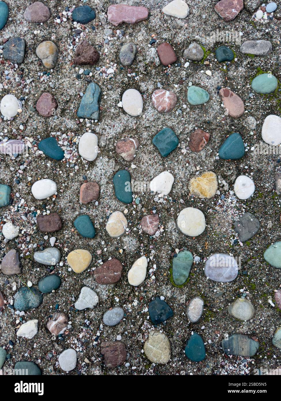 Colorful Pebble Mosaic Embedded in Concrete Stock Photo - Alamy