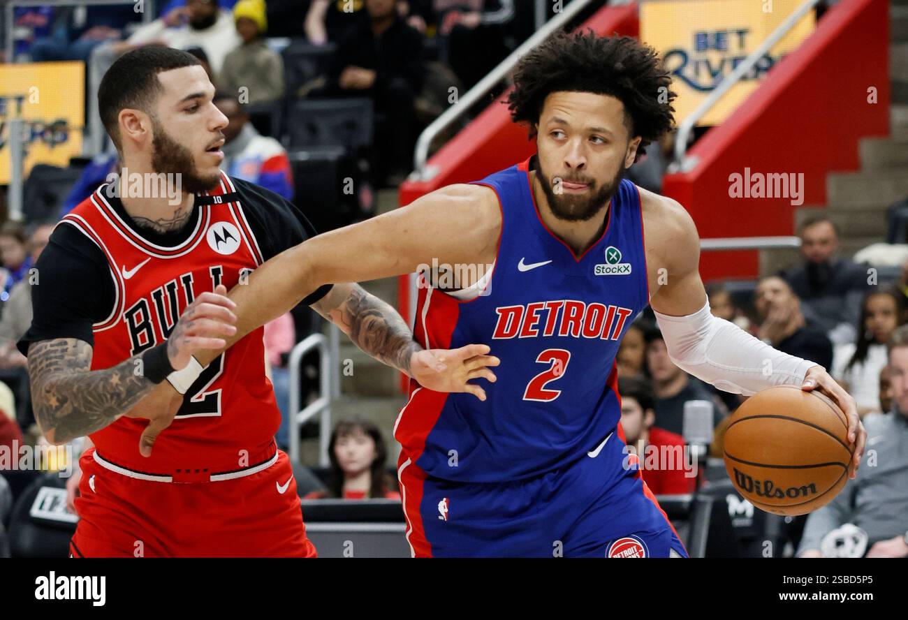 Detroit Pistons guard Cade Cunningham, right, drives to the basket against Chicago Bulls guard ...