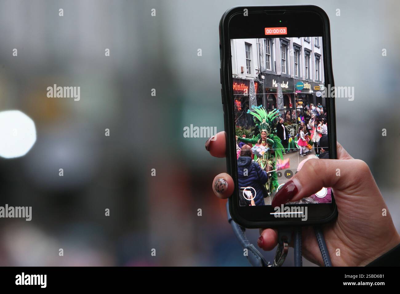 Dublin, Ireland - 02nd February 2025 -a woman's hand holding a phone ...