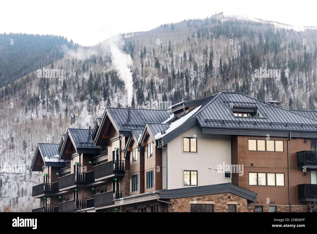 Vail, European style resort town condominium building chimney smoke in ...