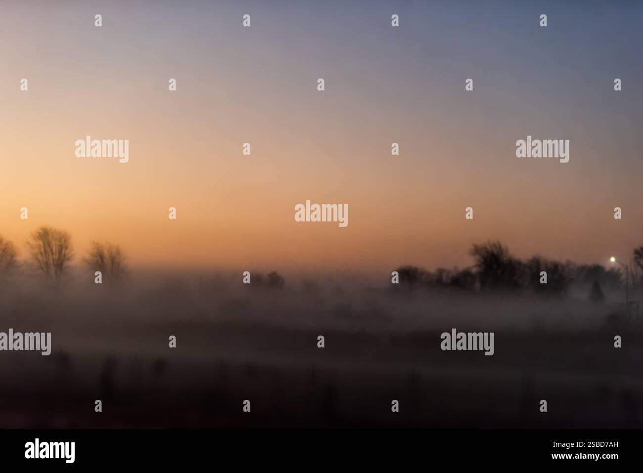 Morning dawn sunrise with lantern in abstract heavy dark mist fog on ...