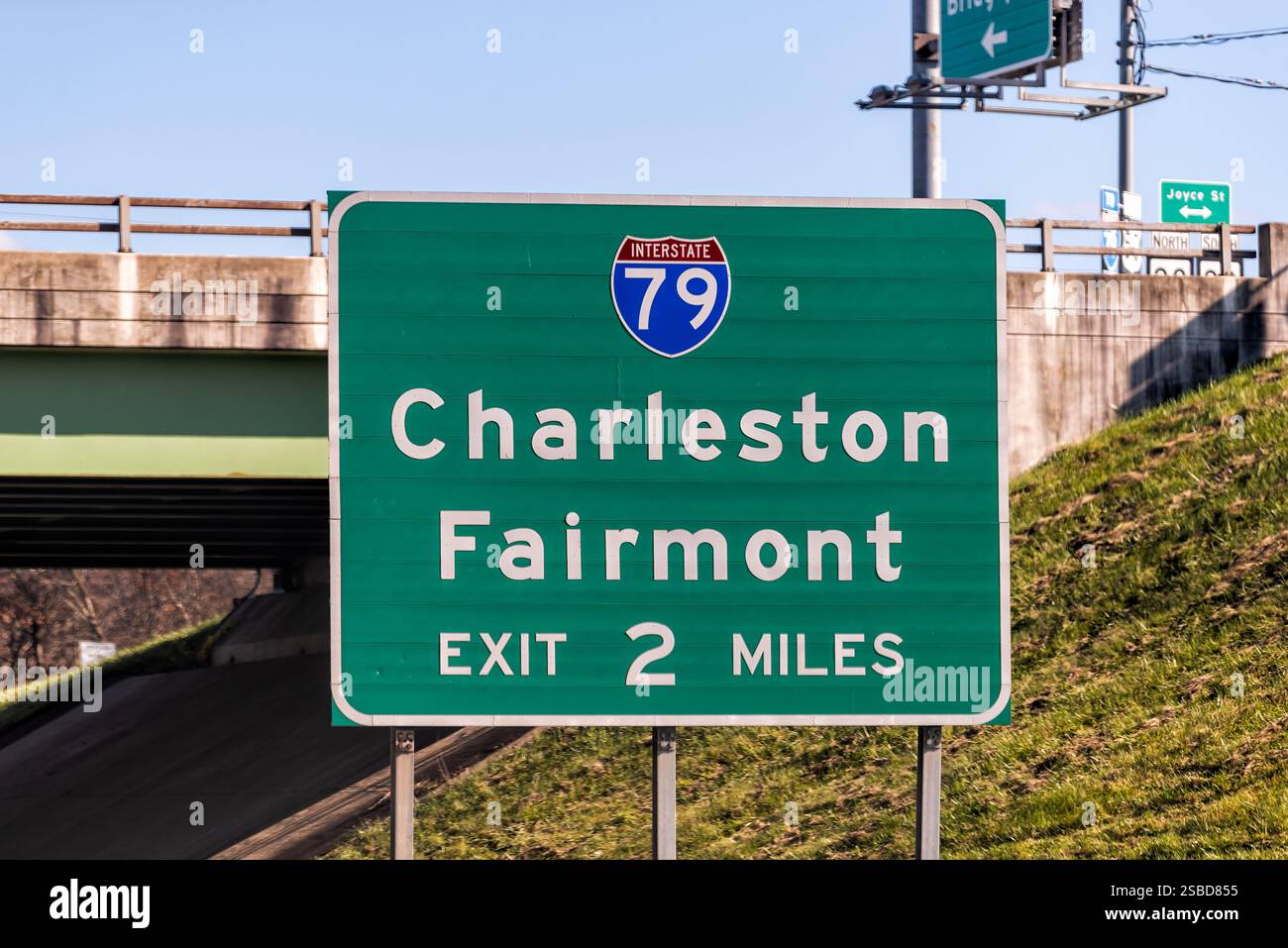 Charleston, Fairmont road sign to interstate highway 79 in West Virginia by overpass bridge in ...