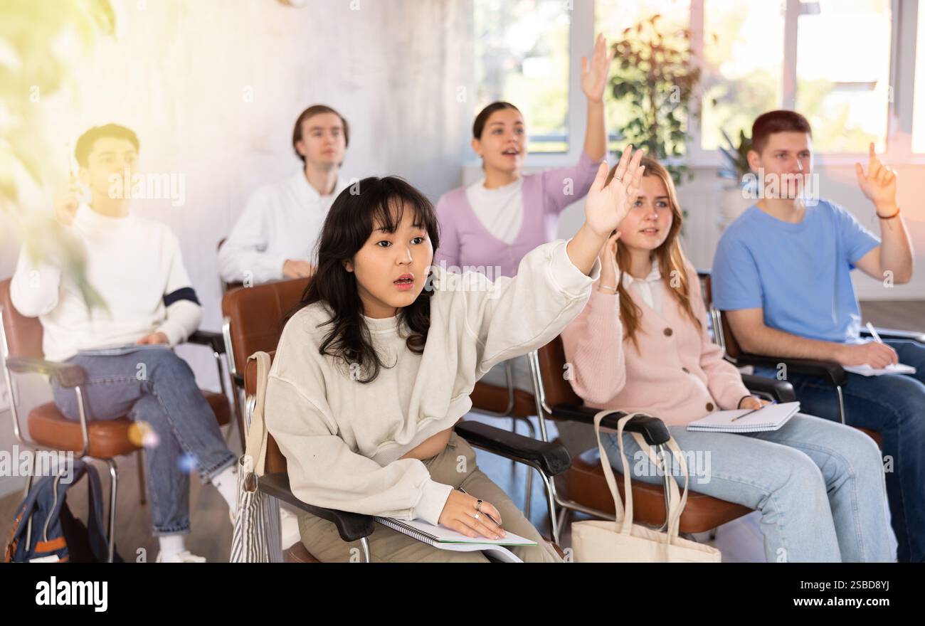 Teenager students listening in classroom school Stock Photo - Alamy