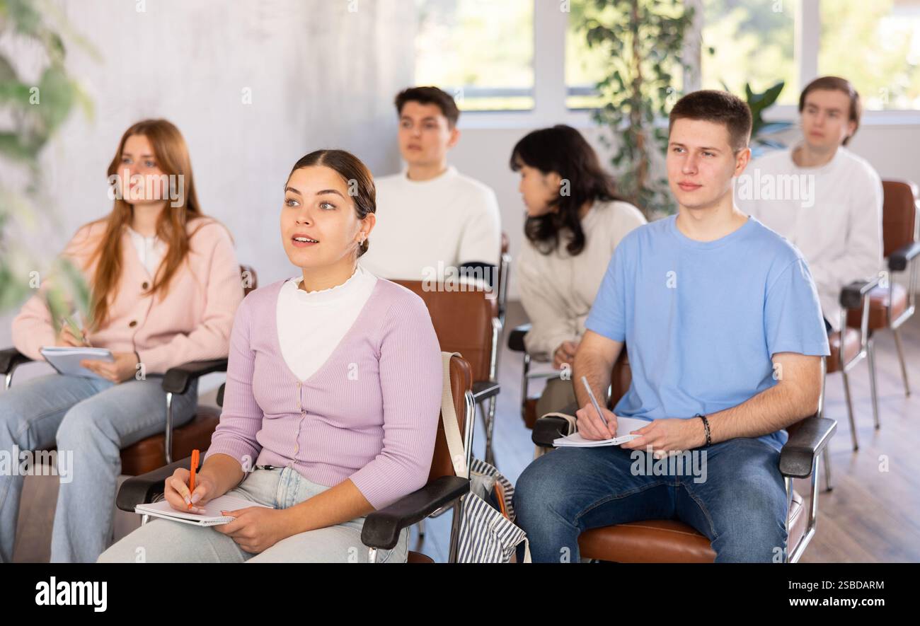Group of high school students listening to lecture in auditorium Stock ...