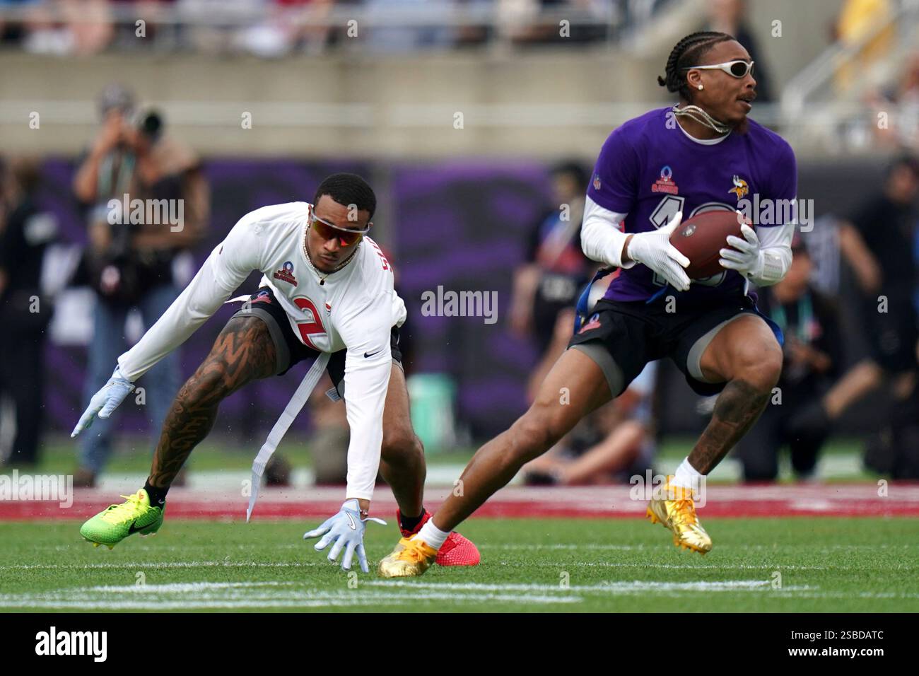 NFC wide receiver Justin Jefferson, right, of the Minnesota Vikings ...