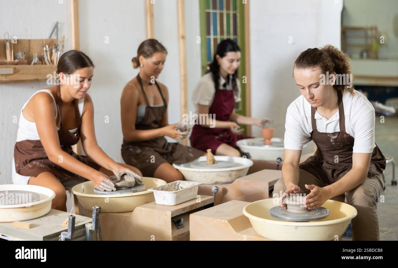 Guy working with pottery wheel Stock Photo - Alamy