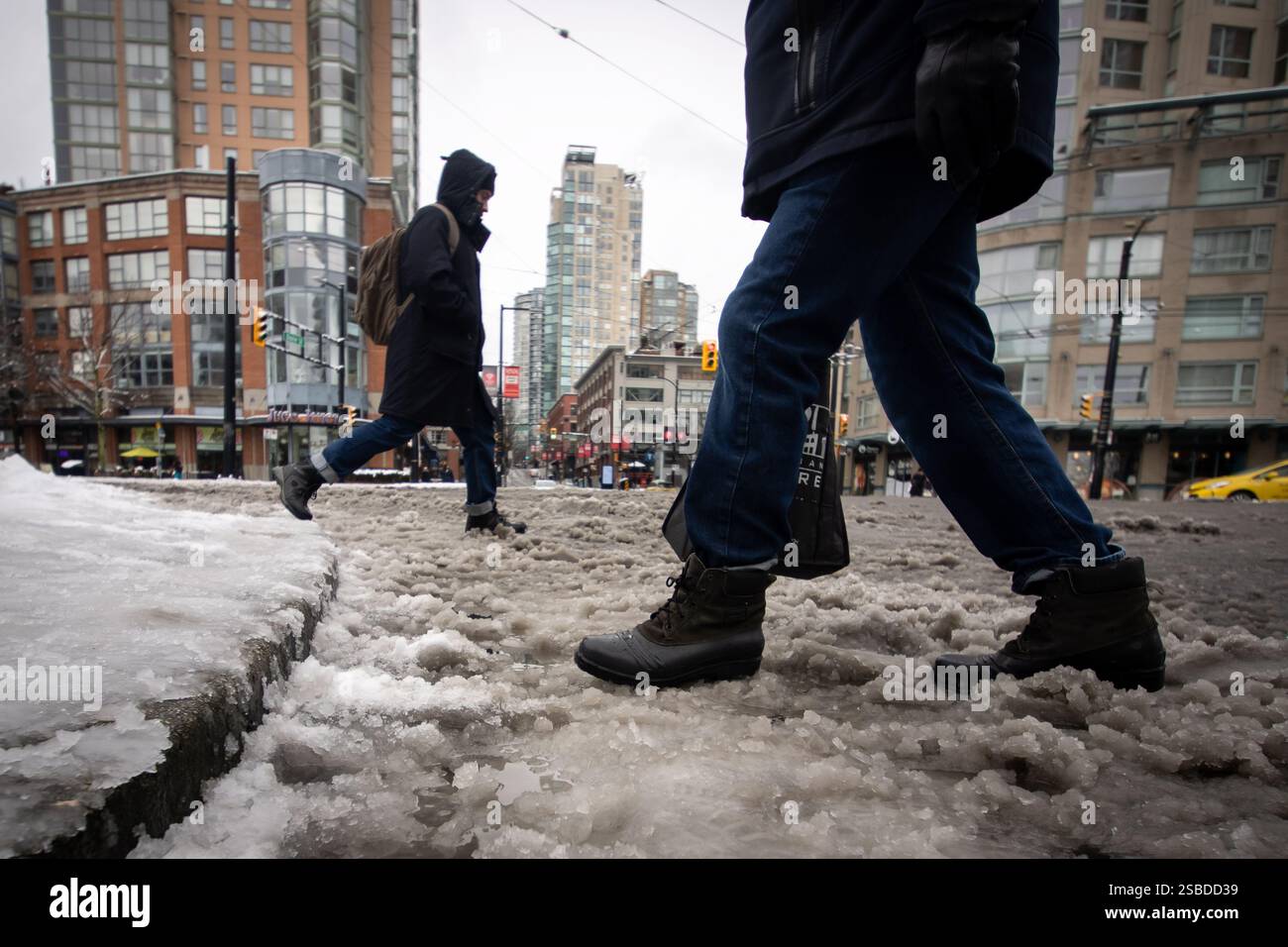 Vancouver, Canada. 02nd Feb, 2025. People walk through slush after some ...