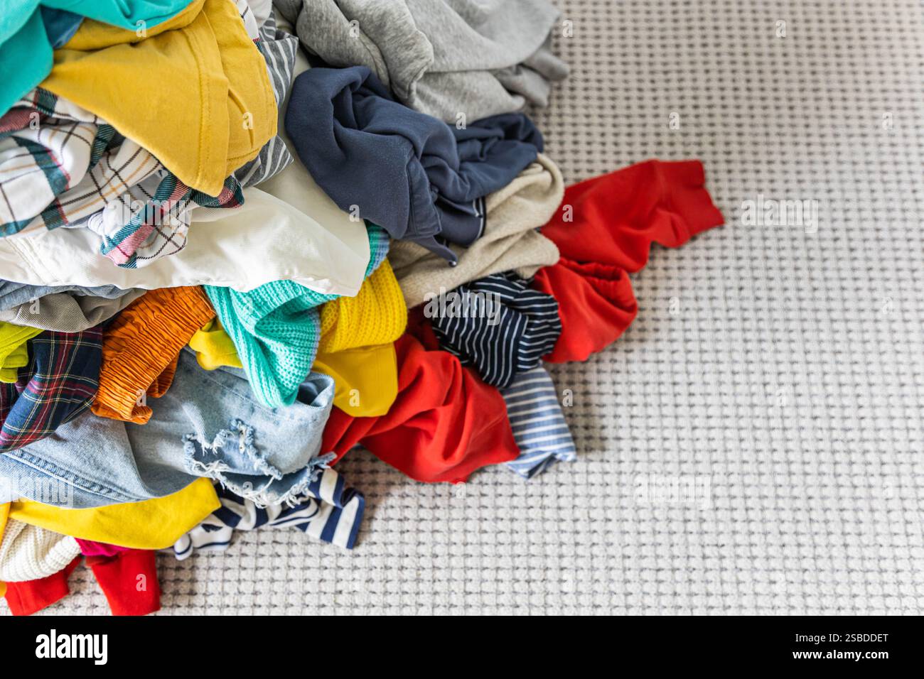 A Bunch of Different Clothes. Recyclable Textile Background. Sorting at ...