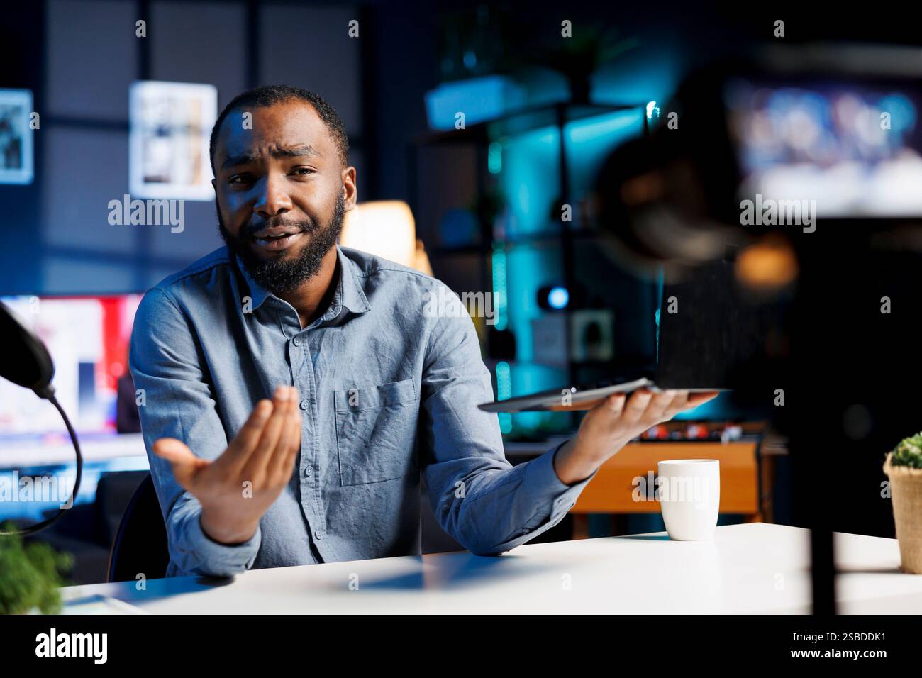 African american content creator filming tech tutorial on how to repair ...