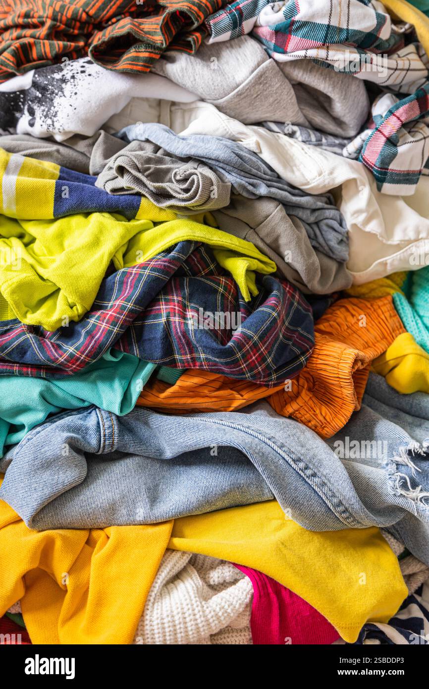 A Bunch of Different Clothes. Recyclable Textile Background. Sorting at ...