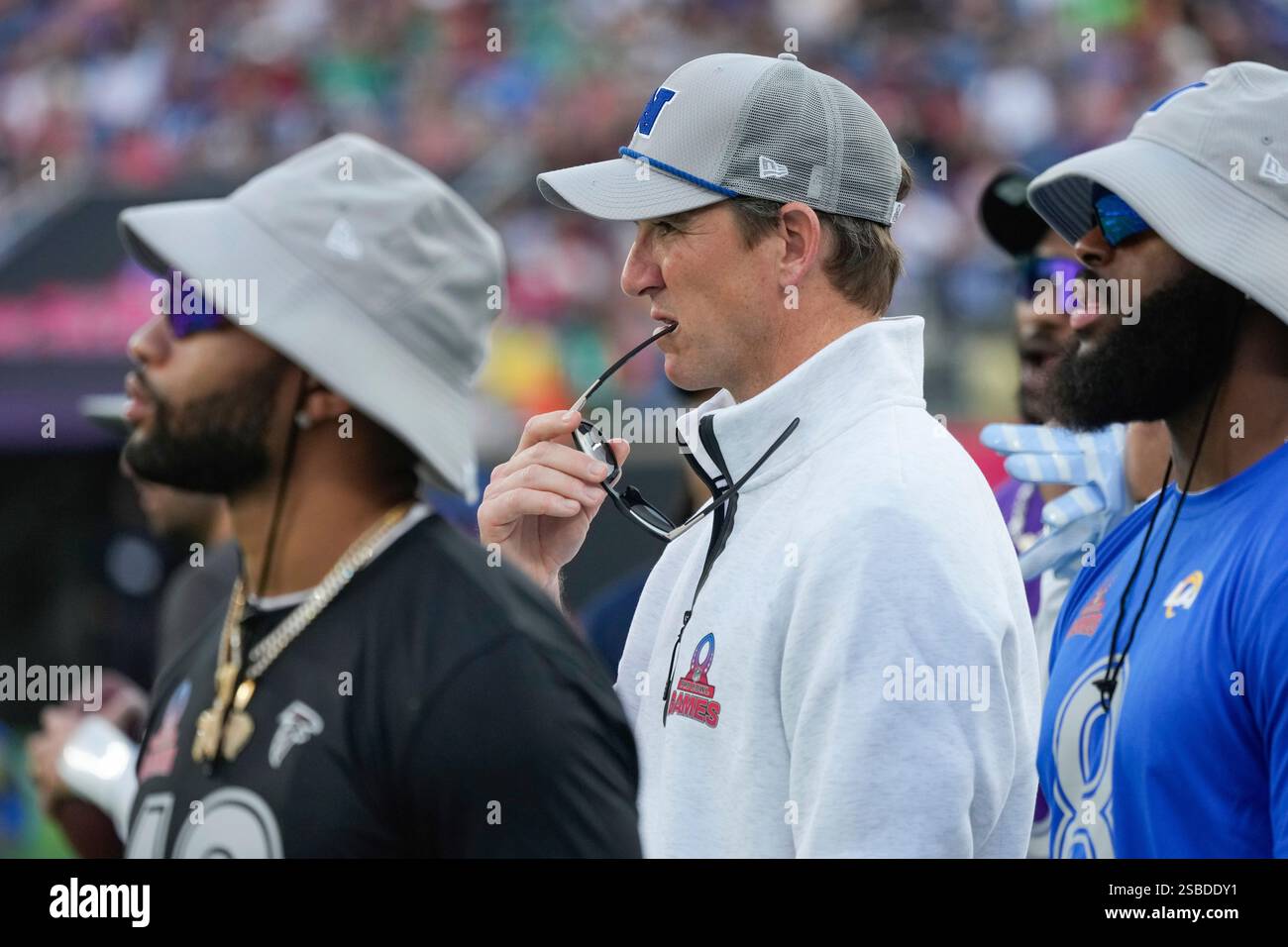 NFC coach Eli Manning, center, watches from the sideline during the ...