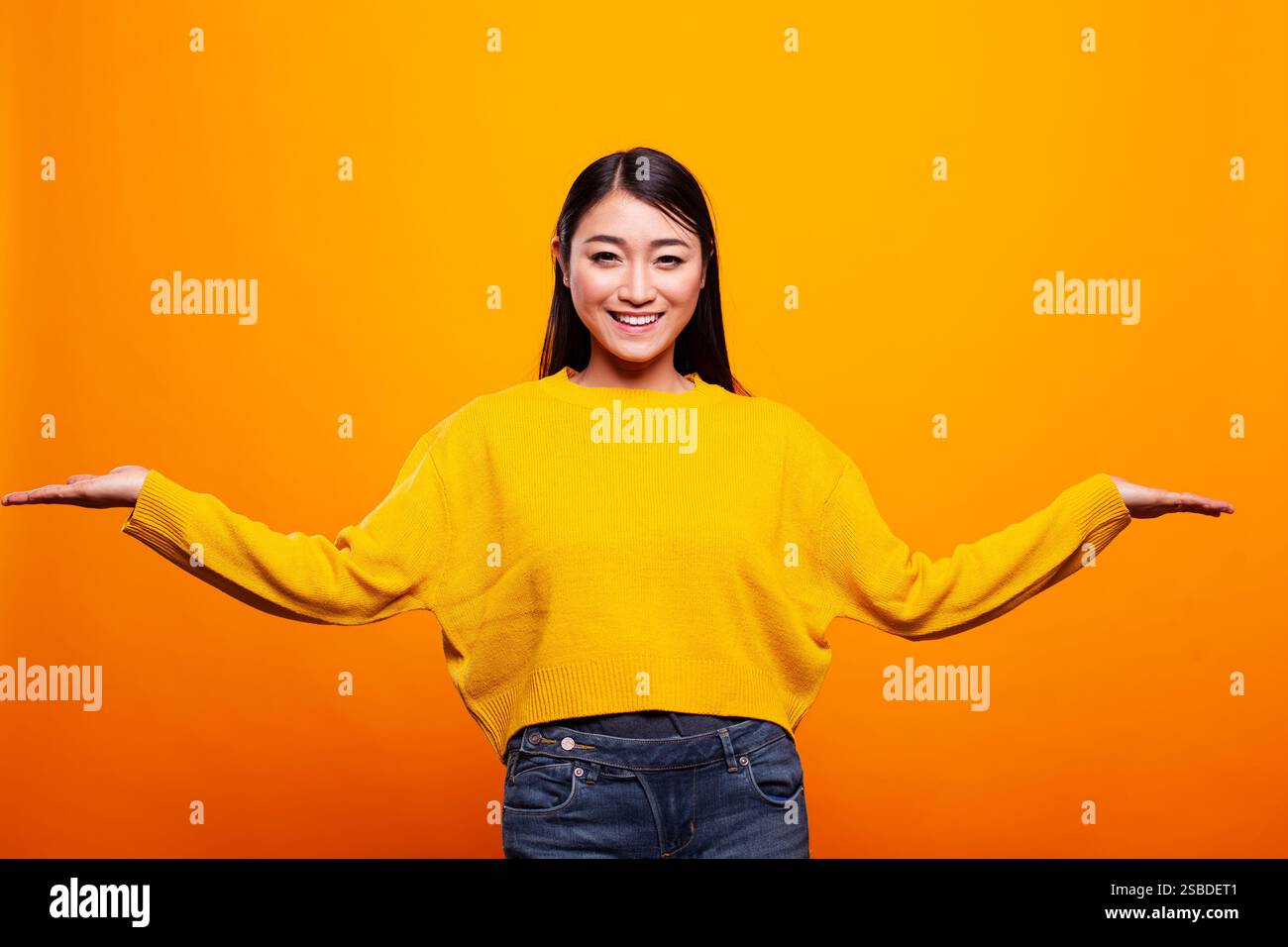 Woman smiles gestures open palms hi-res stock photography and images ...
