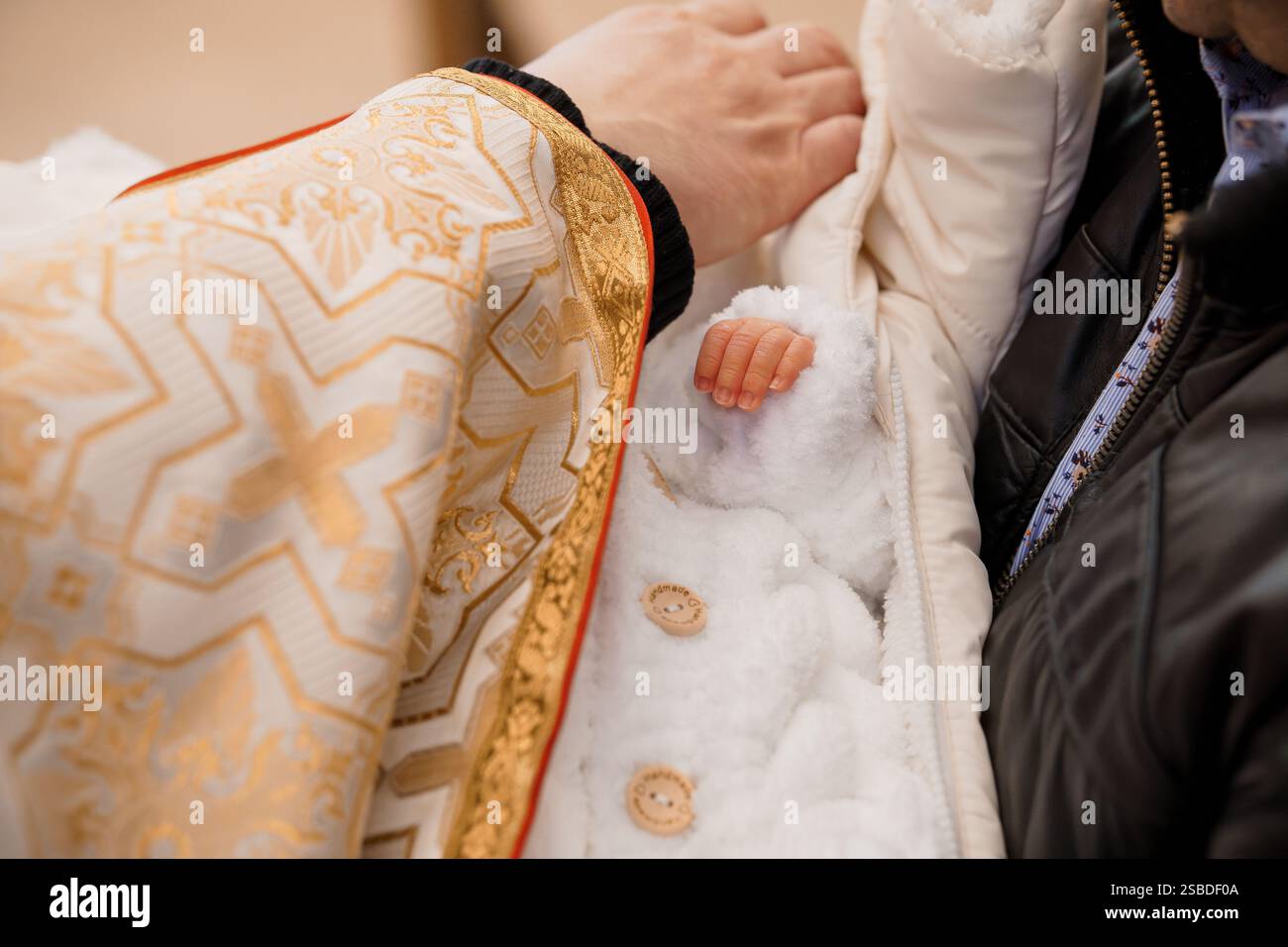 Baptism Ceremony with a Baby in a White Outfit and Ornate Robe Stock ...