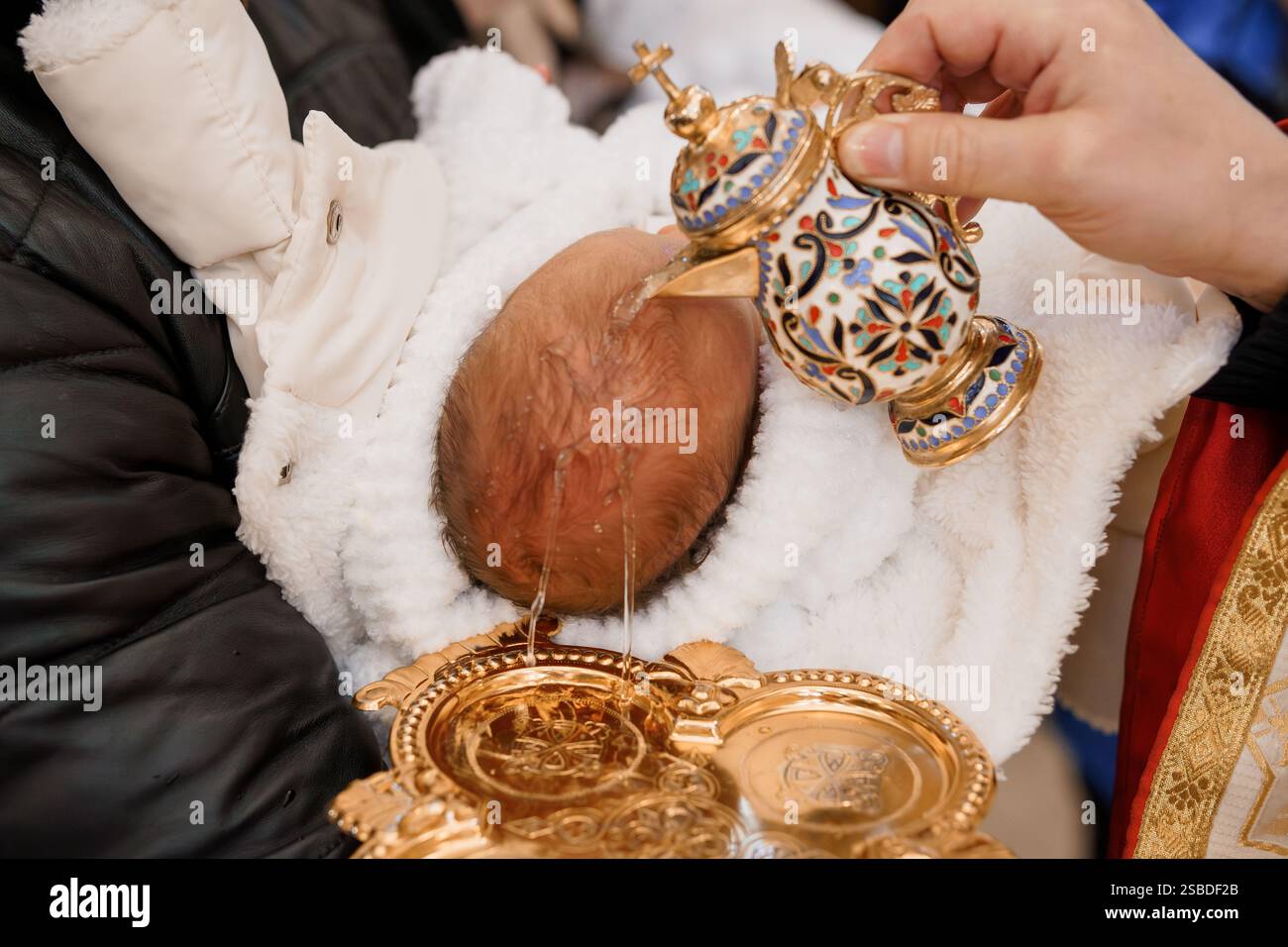 Baptism Ceremony Featuring an Infant Receiving Holy Water in an Ornate ...