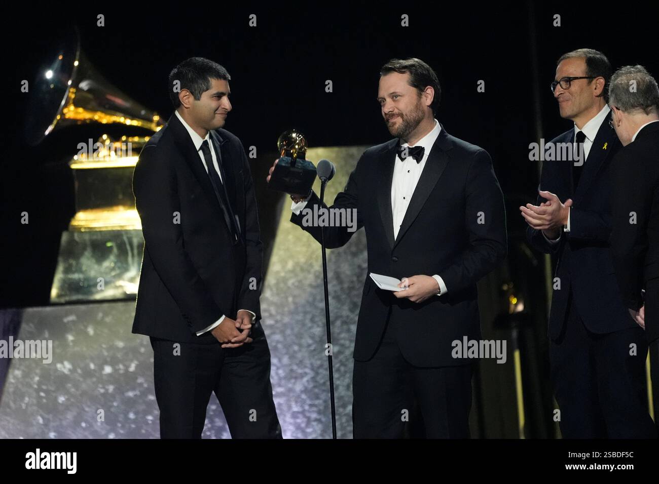 Kabir Sehgal, left, and Jason Carter accepts the award for best ...