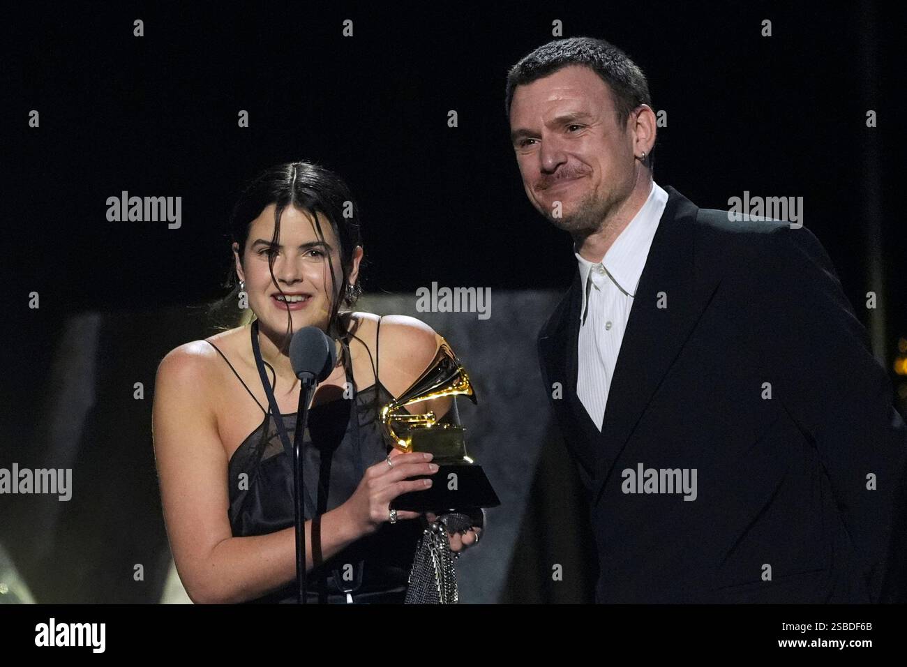 Imogene Strauss, left, and Brent David Freaney accepts the award for ...