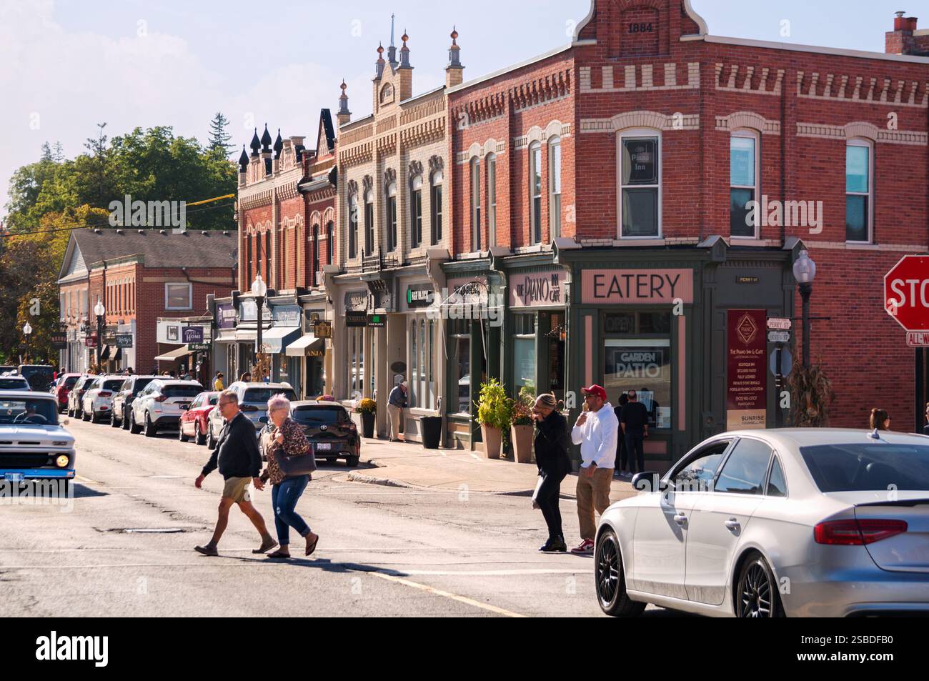 Port Perry, Ontario, Canada - 2024 10 05: People crossing Queen Street ...