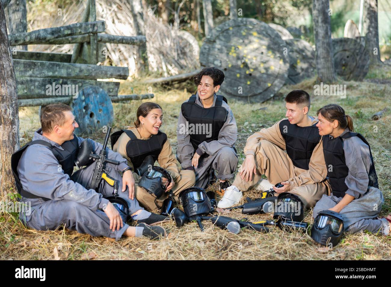 Group of paintball players with guns after match on paintball playing ...