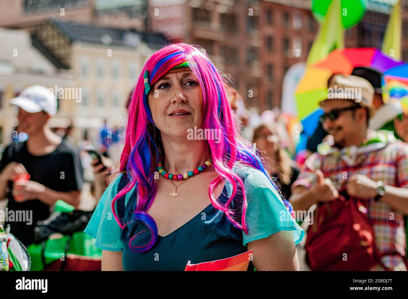 Woman in pink and blue hair in pride parade Stock Photo - Alamy