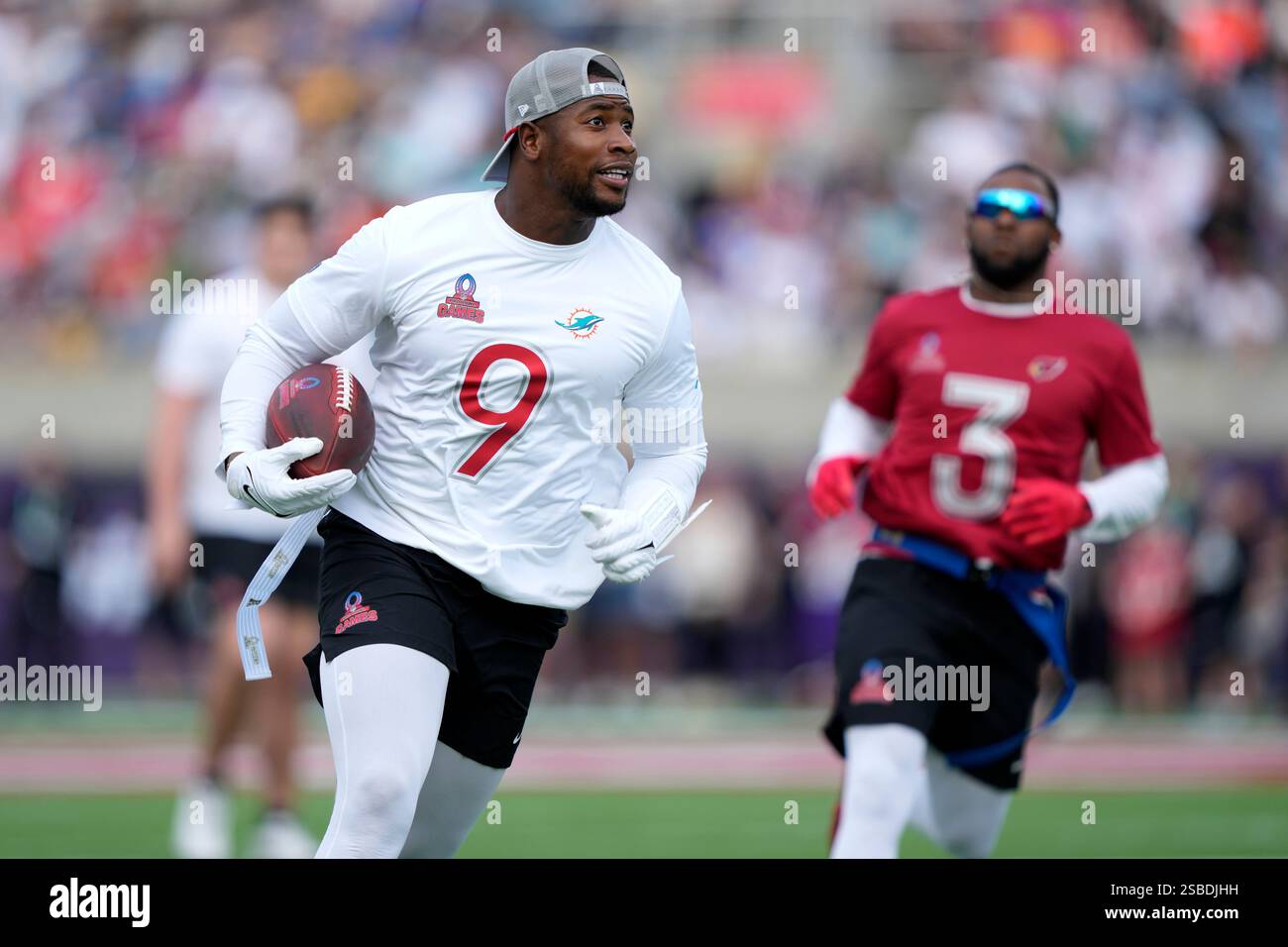 AFC tight end Jonnu Smith (9), of the Miami Dolphins, carries the ball ...