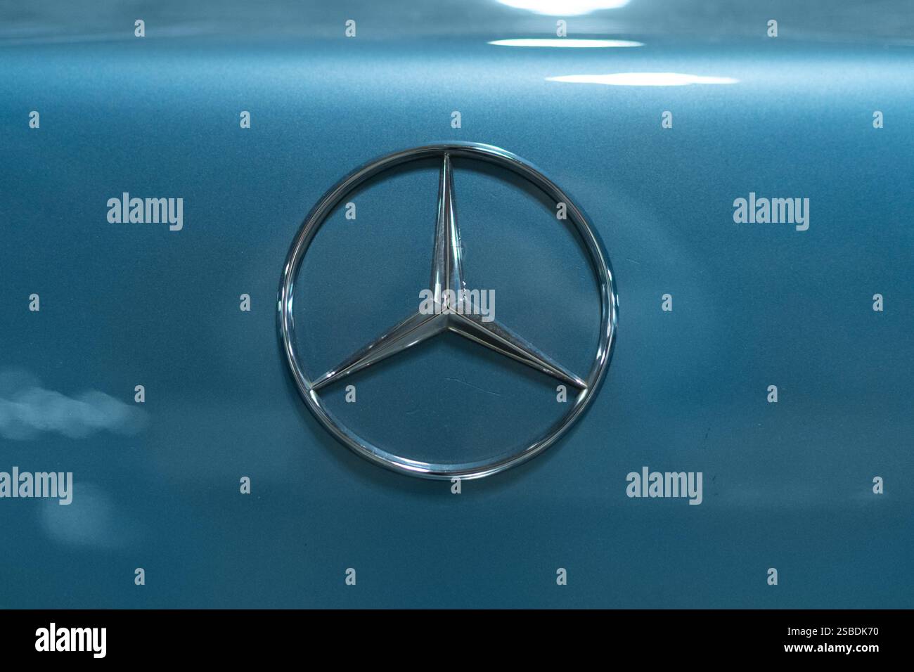 Milan, Italy - 12.11.2022: Classic Mercedes Benz emblem on vintage blue ...