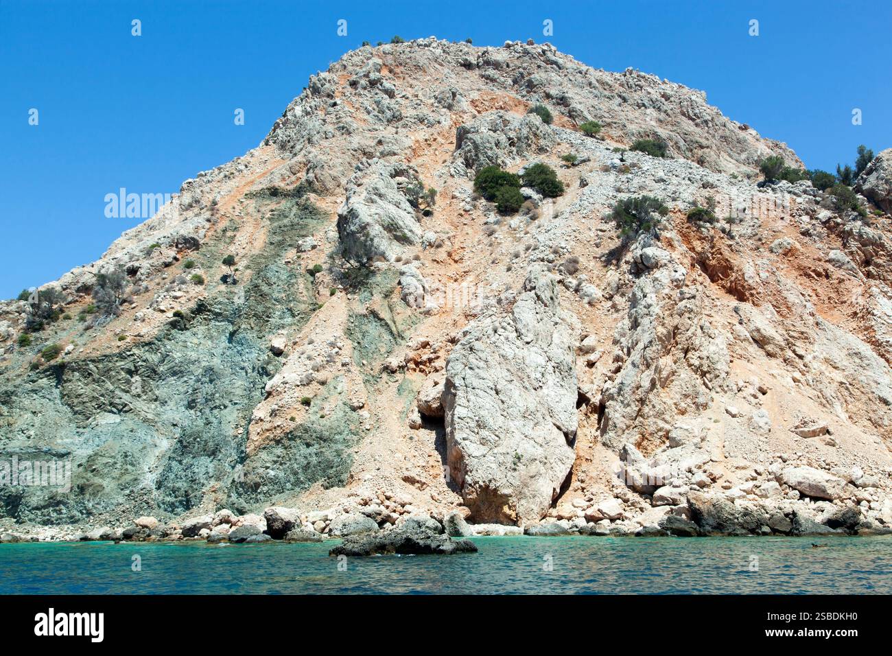 The scenic view of colorful steep rocks on uninhabited tourist island ...