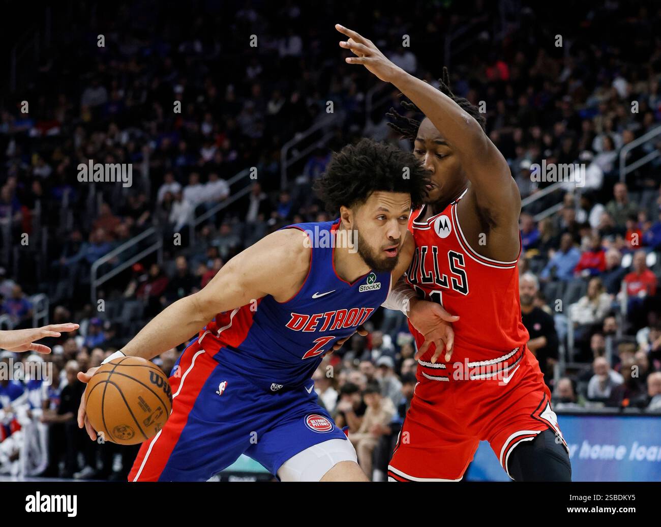 Detroit Pistons guard Cade Cunningham (2) drives against Chicago Bulls guard Ayo Dosunmu (11 ...