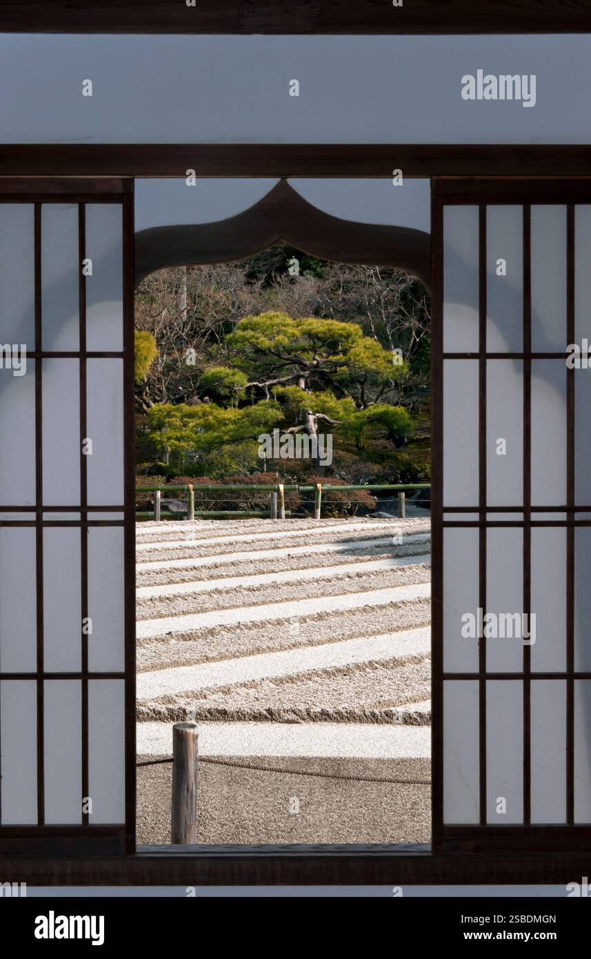 Sliding shoji paper screen window covering offering a peek view at the ...