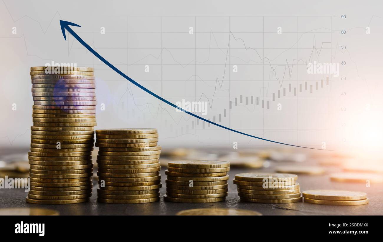 Financial growth concept. Stacks of gold coins on table and raising ...