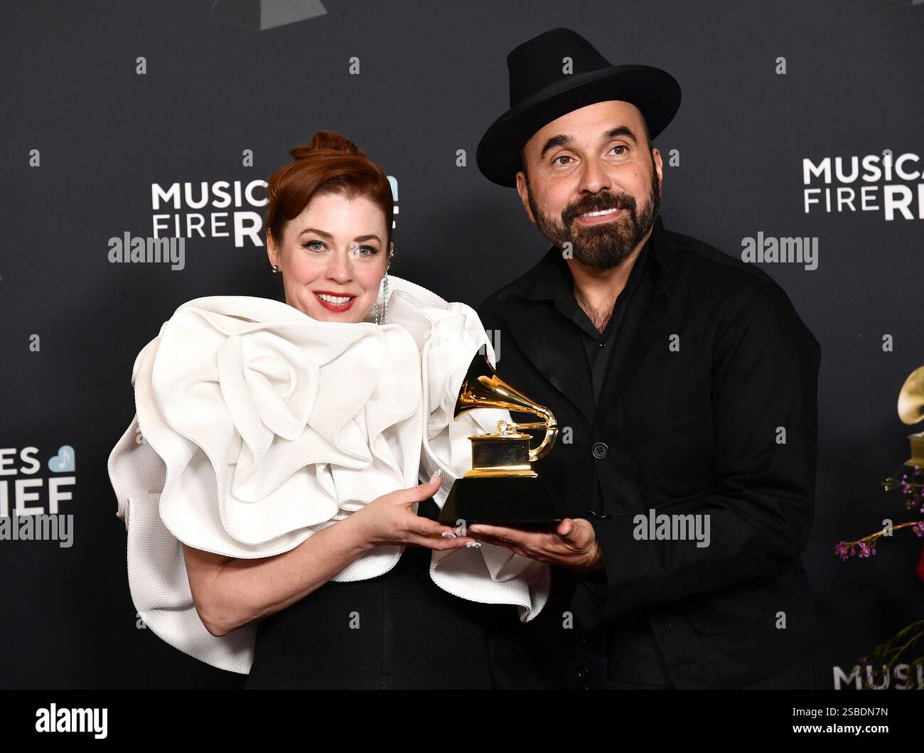 Alisha Gaddis, left, and Lucky Diaz pose in the press room with the ...