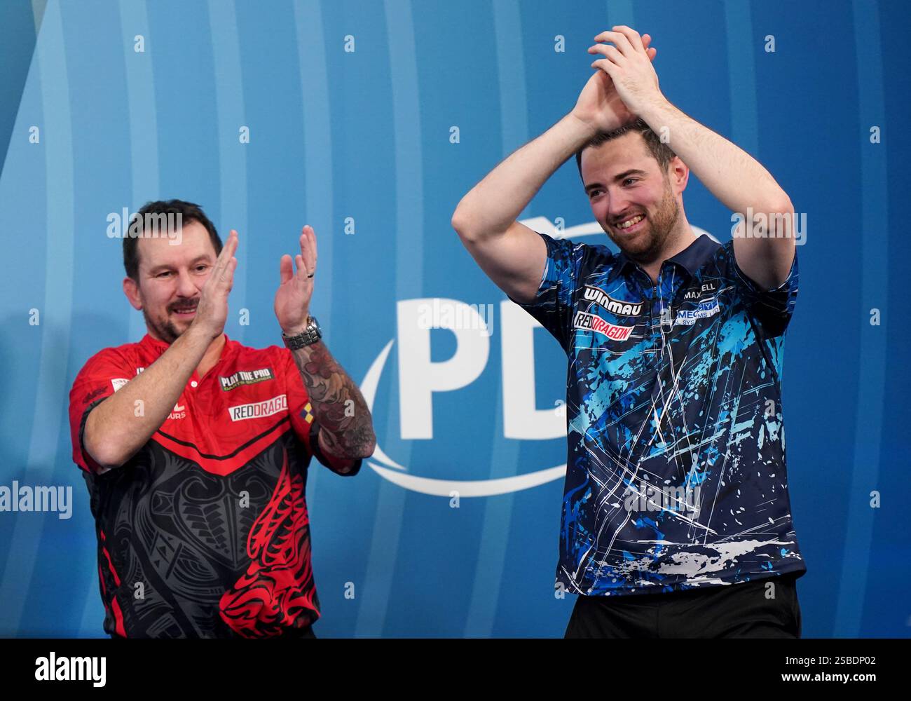 Luke Humphries celebrates after beating Jonny Clayton in the final of ...