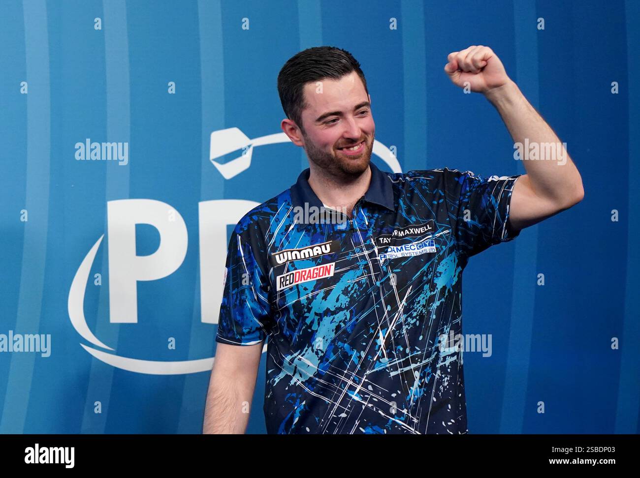Luke Humphries celebrates after beating Jonny Clayton in the final of ...