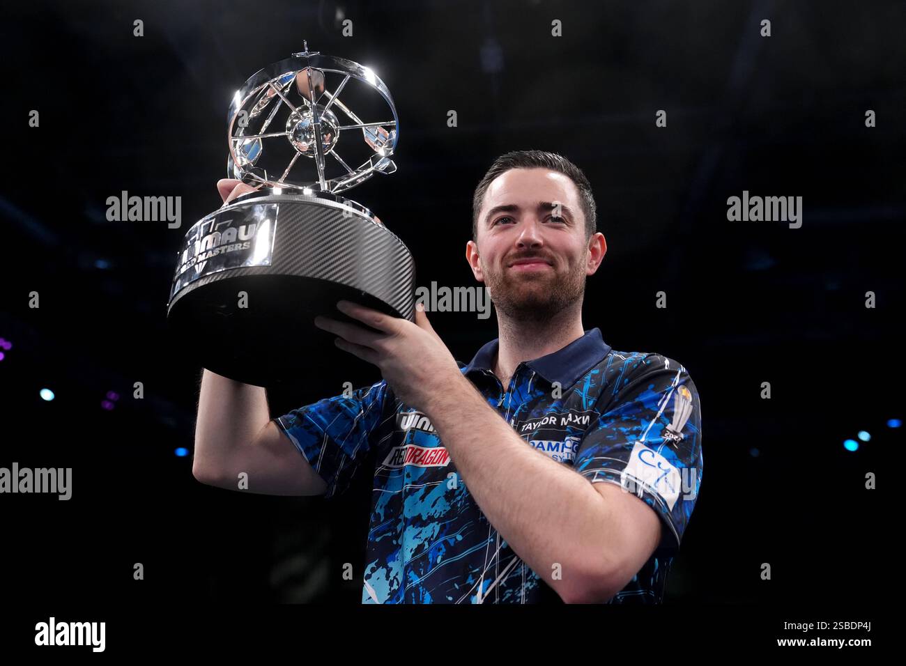 Luke Humphries with his trophy after winning against Jonny Clayton in ...