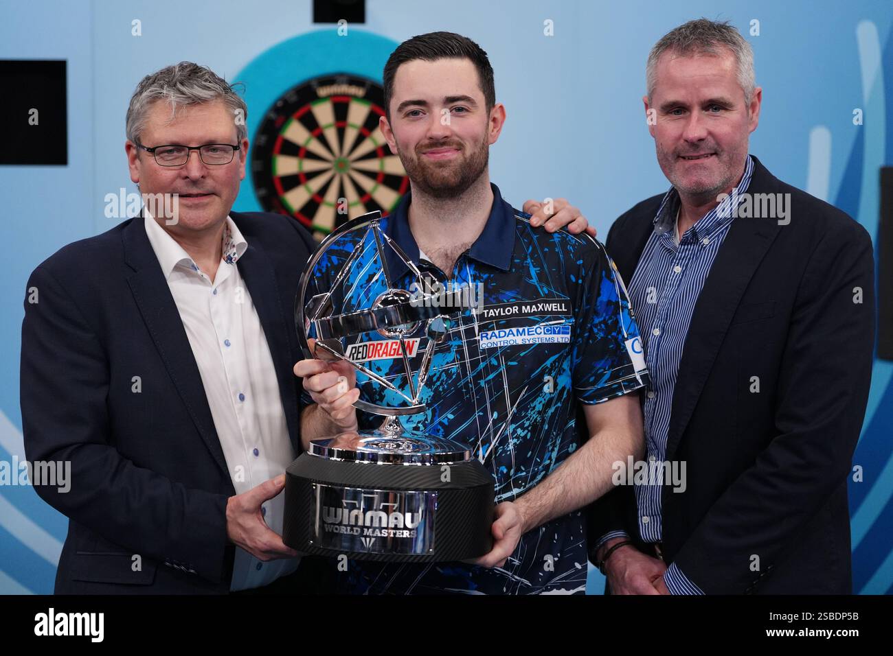 Luke Humphries with his trophy after winning against Jonny Clayton in ...