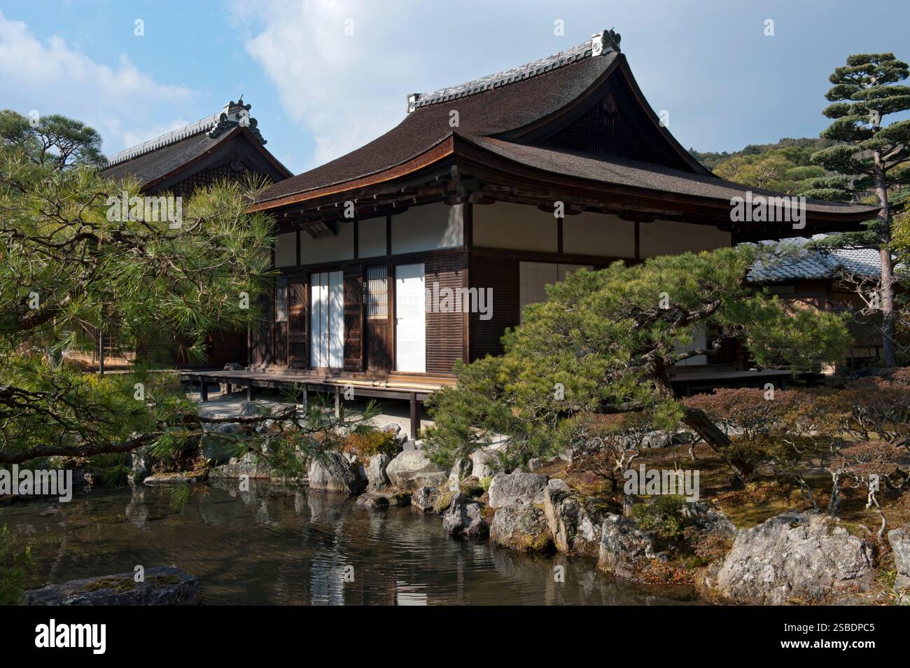 Togudo Hall sitting beside a pond surrounded by landscape garden at ...