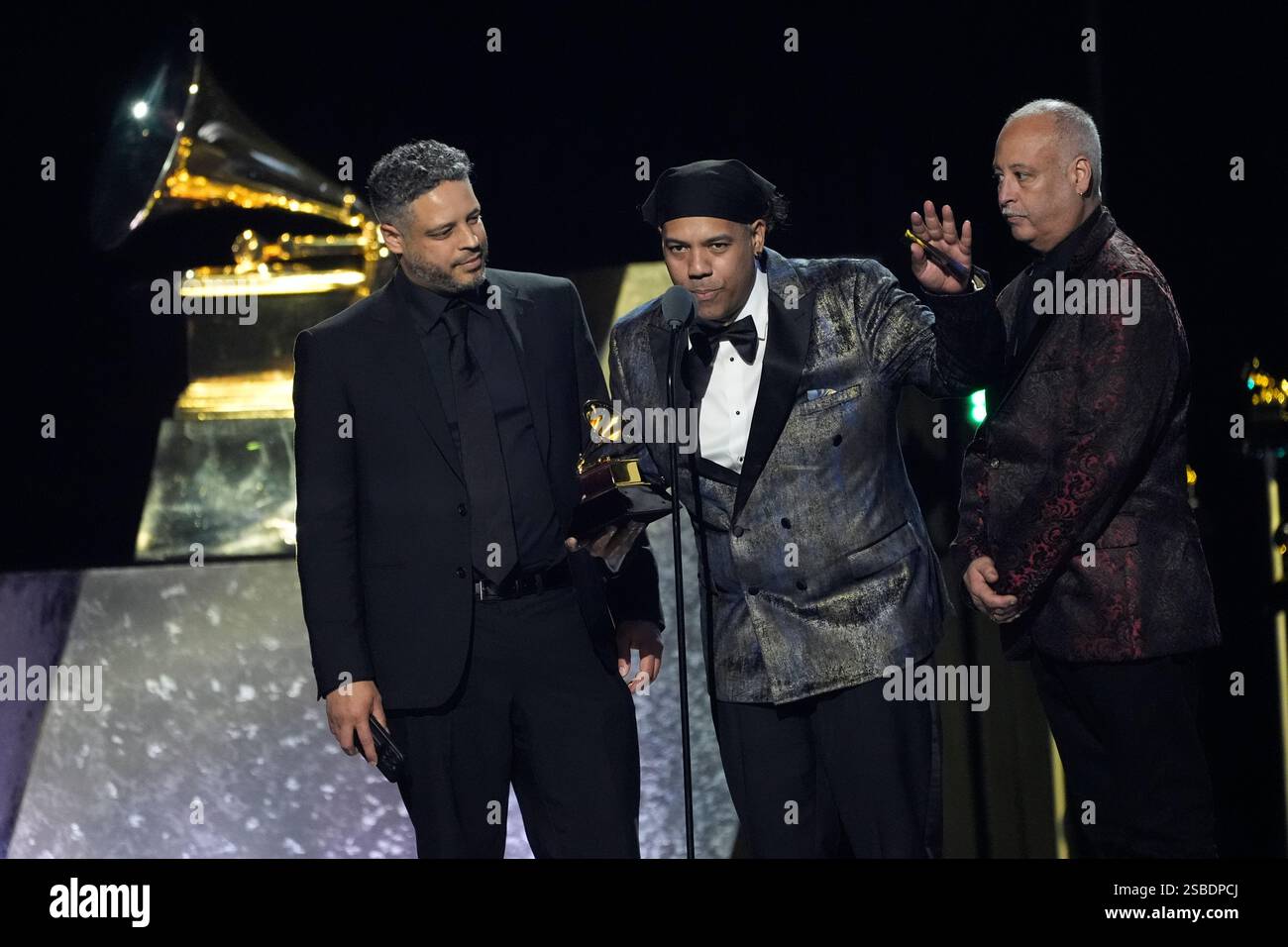 Zaccai Curtis, from left, Reinaldo de Jesus, and Willie Martinez accept ...