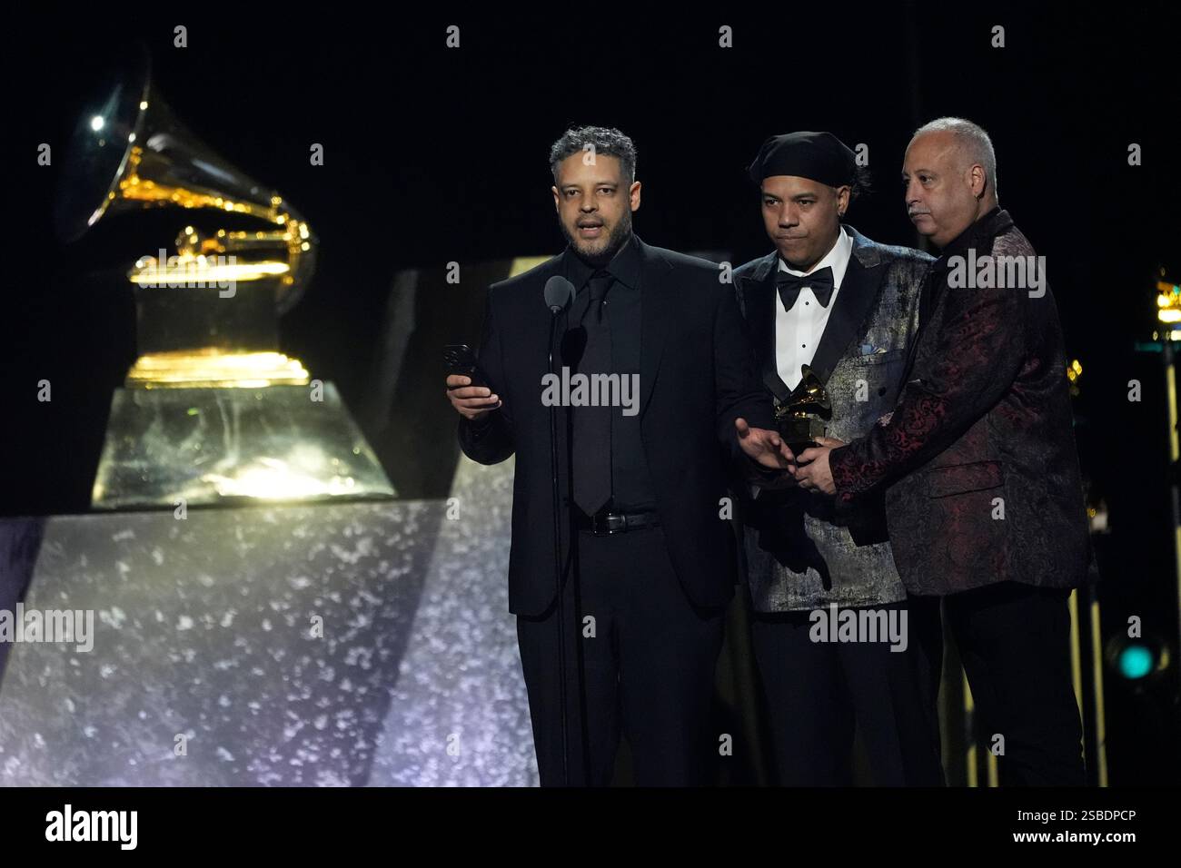 Zaccai Curtis, from left, Reinaldo de Jesus, and Willie Martinez accept ...